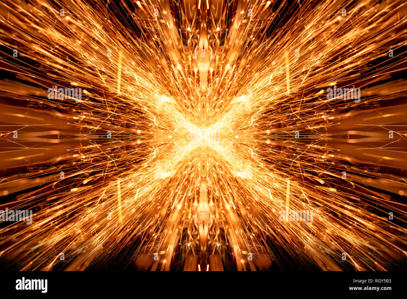 Bright orange and yellow sparks on a black background. A stream of ...