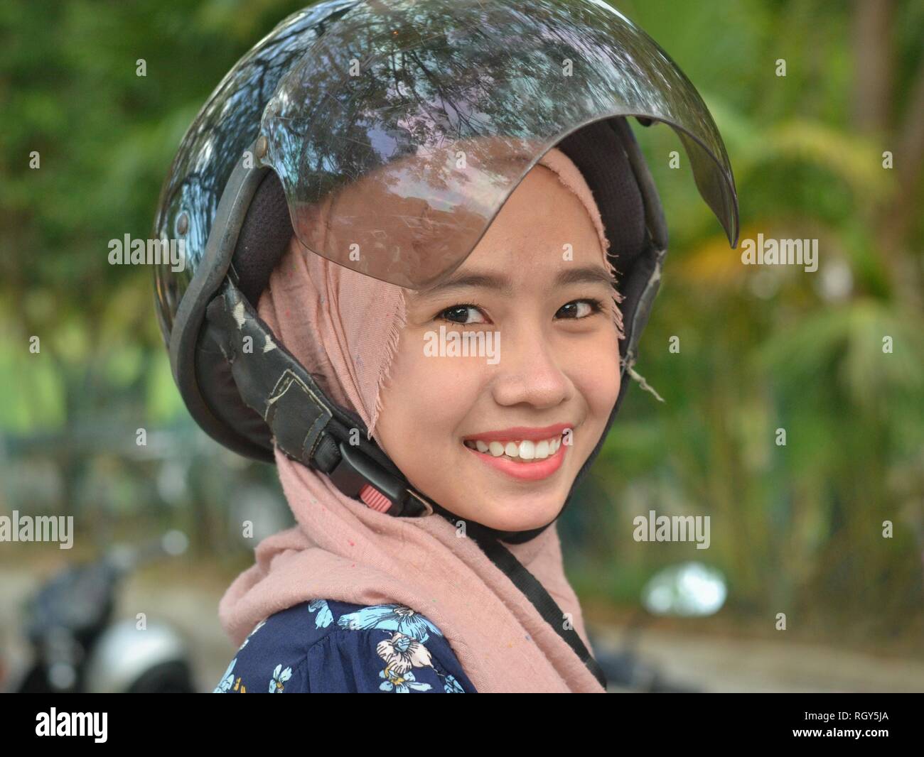 Posing smiling helmet hi-res stock photography and images - Alamy