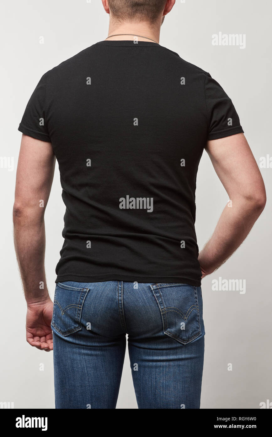 back view of man in black t-shirt with copy space isolated on grey ...