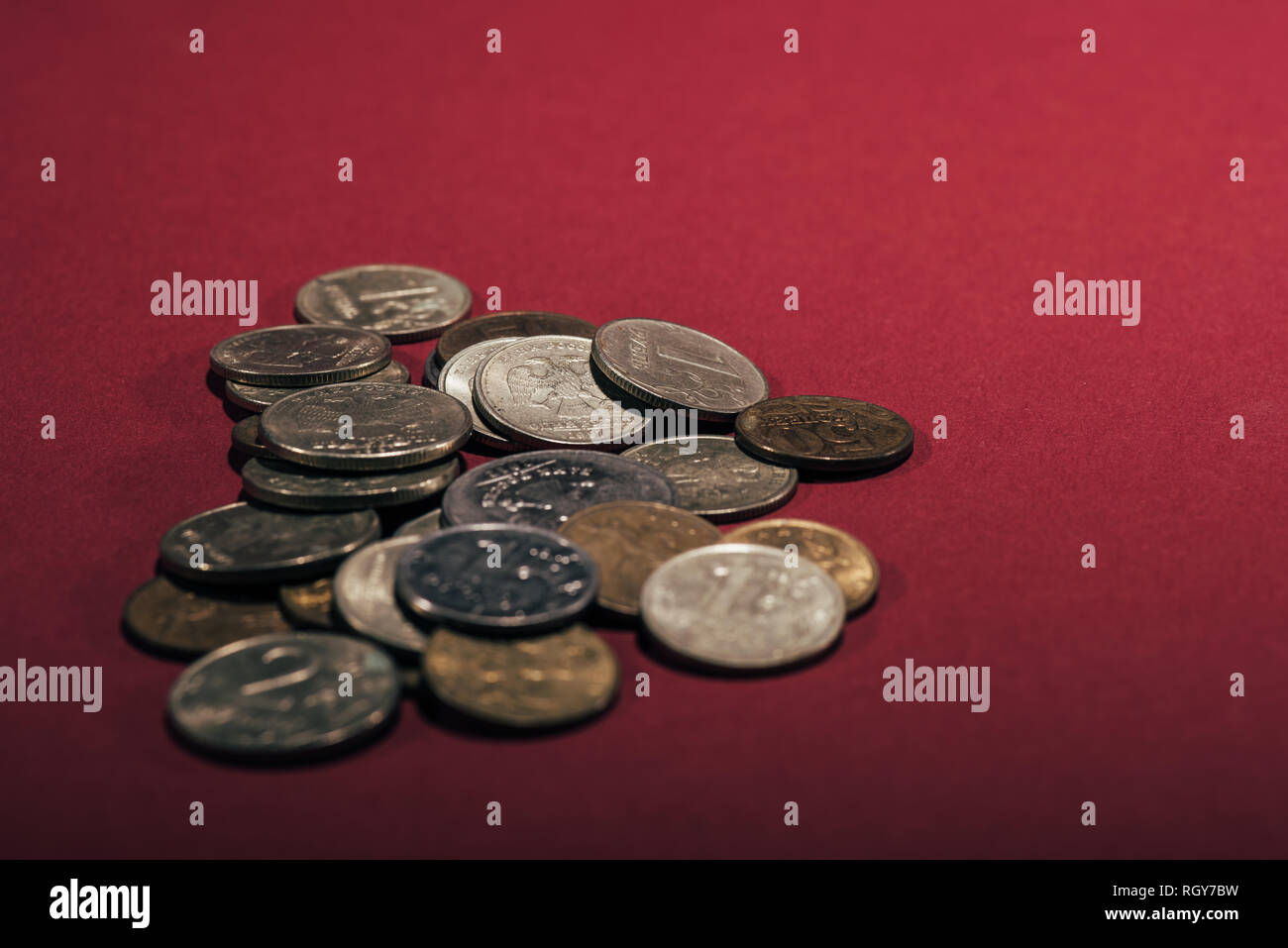 close-up view of russian rubles coins on red background Stock Photo - Alamy