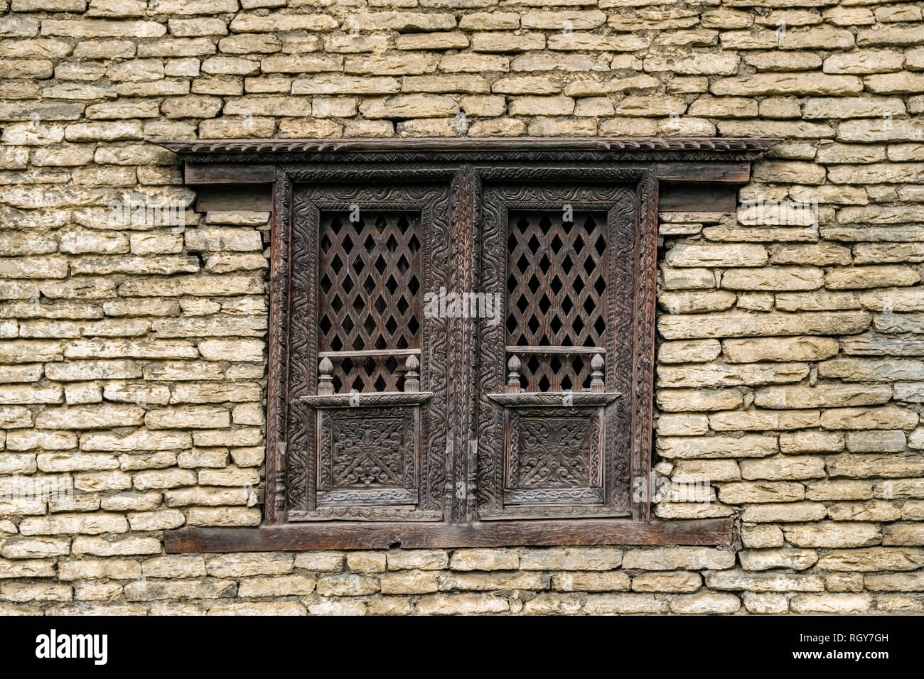 Facade and wooden carved windows of a traditional house Stock Photo - Alamy