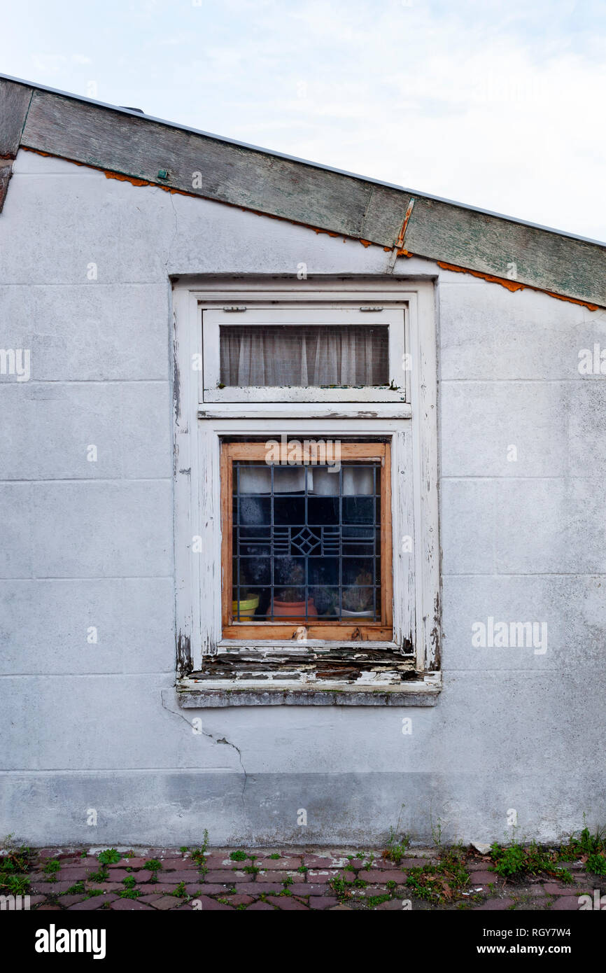 Wall with an old rotten wooden window in Oudewater in the Netherlands ...