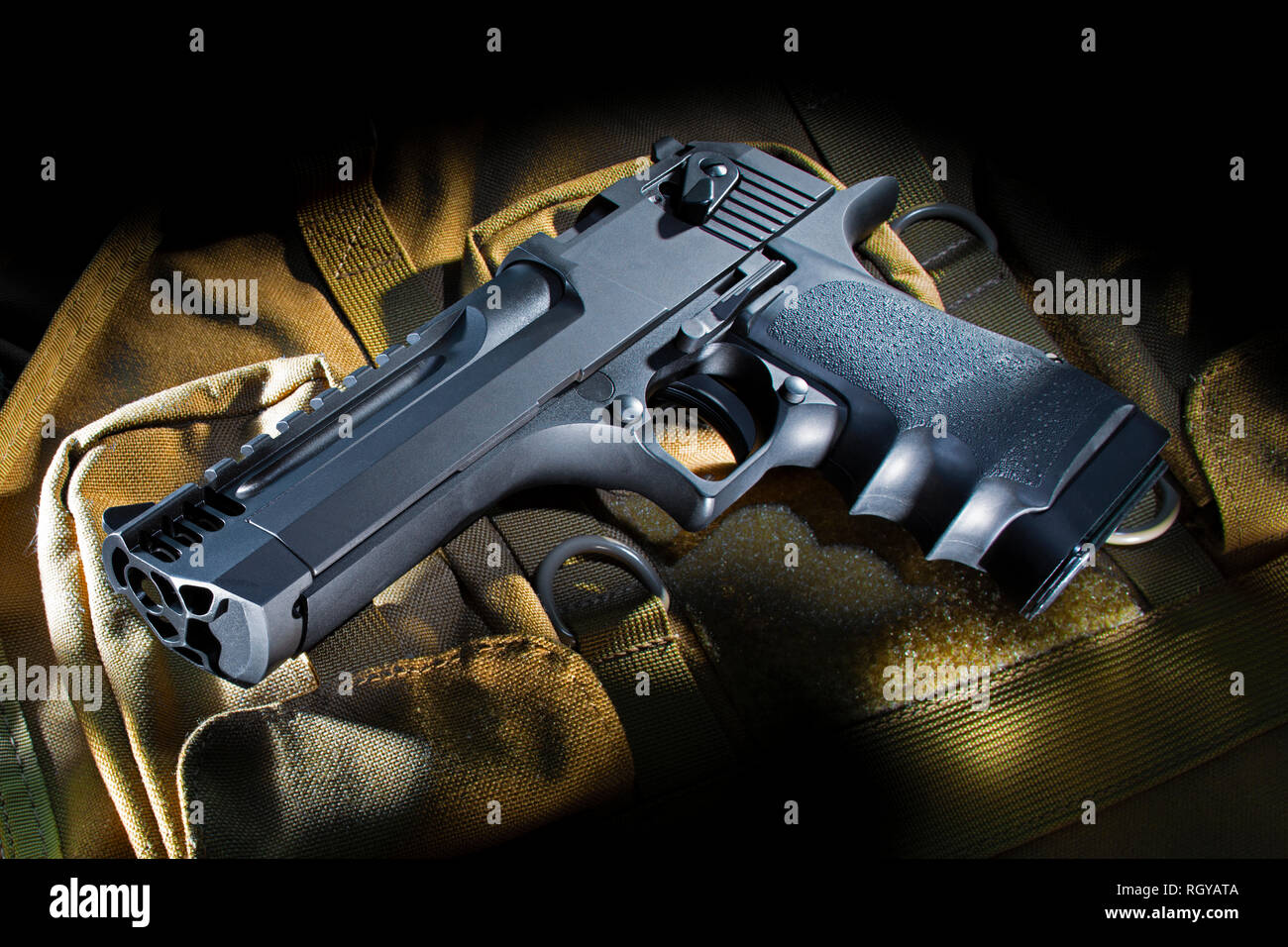 Black semi auto handgun on a beige nylon bag Stock Photo - Alamy