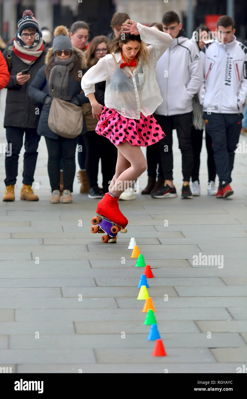 London, England, UK. Street performer rollerskating in Trafalgar Square ...