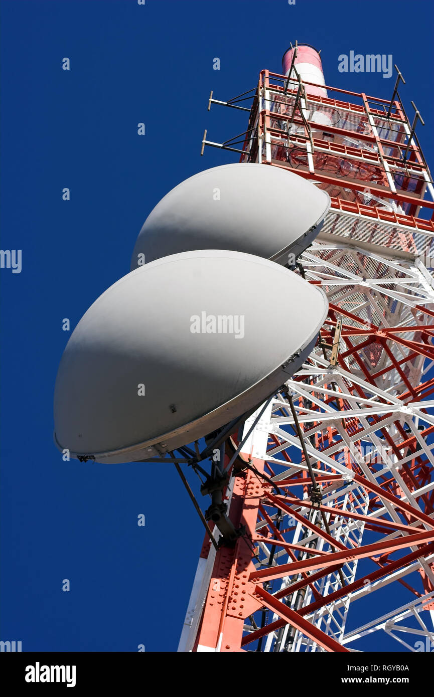 Red and white tower of communication with their antennas Stock Photo ...