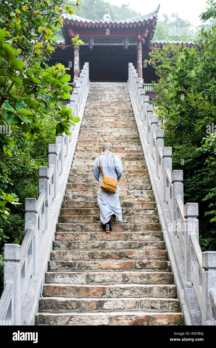 Shaolin monk, walking on a temple stairs Stock Photo - Alamy