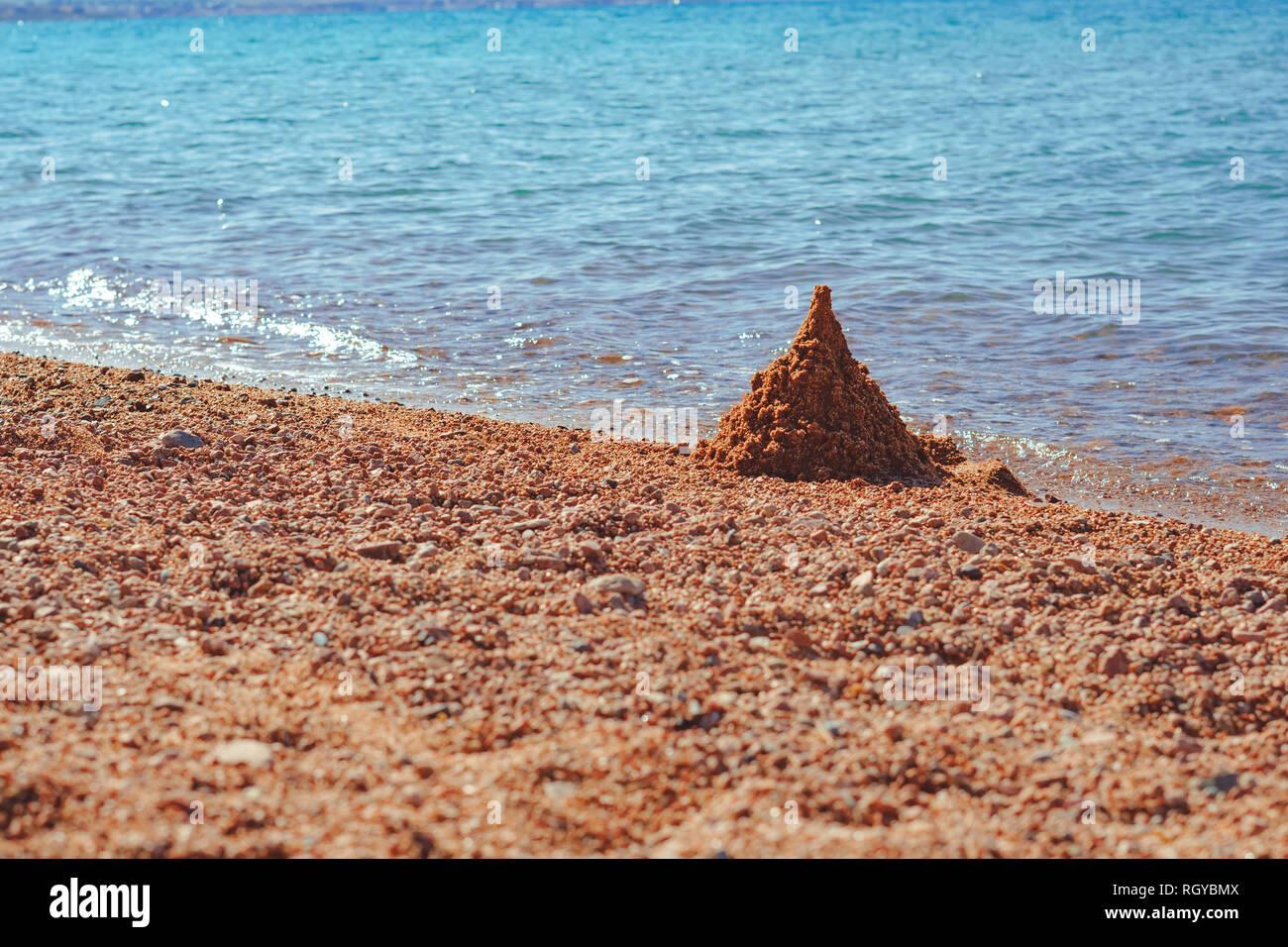 a small slide of wet sand on the beach Stock Photo - Alamy
