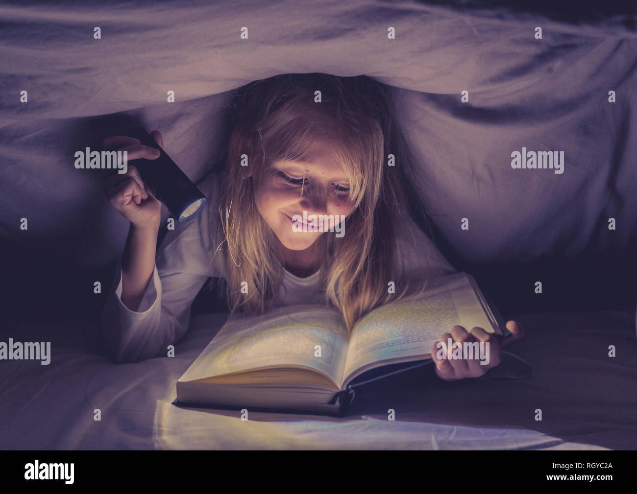Kid reading in night school hi-res stock photography and images - Alamy