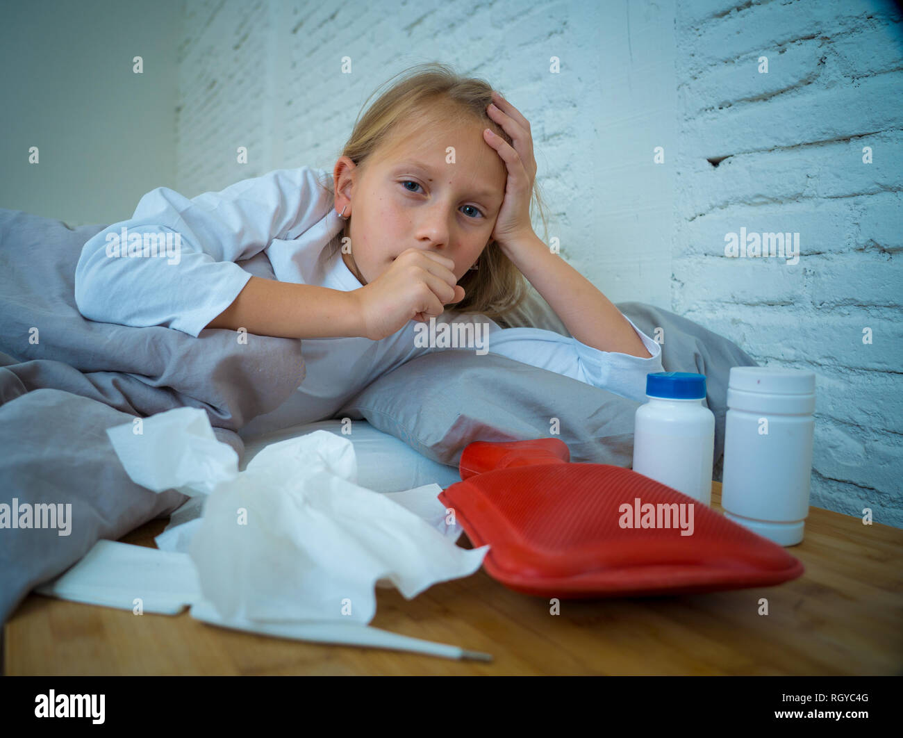 Sweet Sick Cute Girl Feeling Sick Lying In Bed With Medicines Thermometer Hot Water Bag
