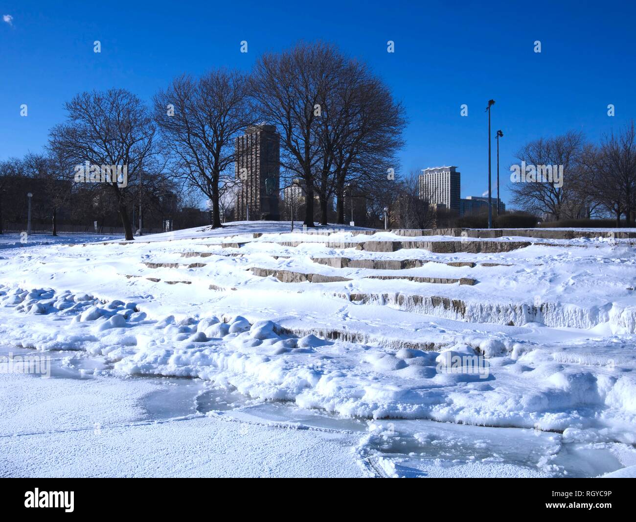 Frozen Lake Michigan with sheet of ice and snow during polar vortex in ...