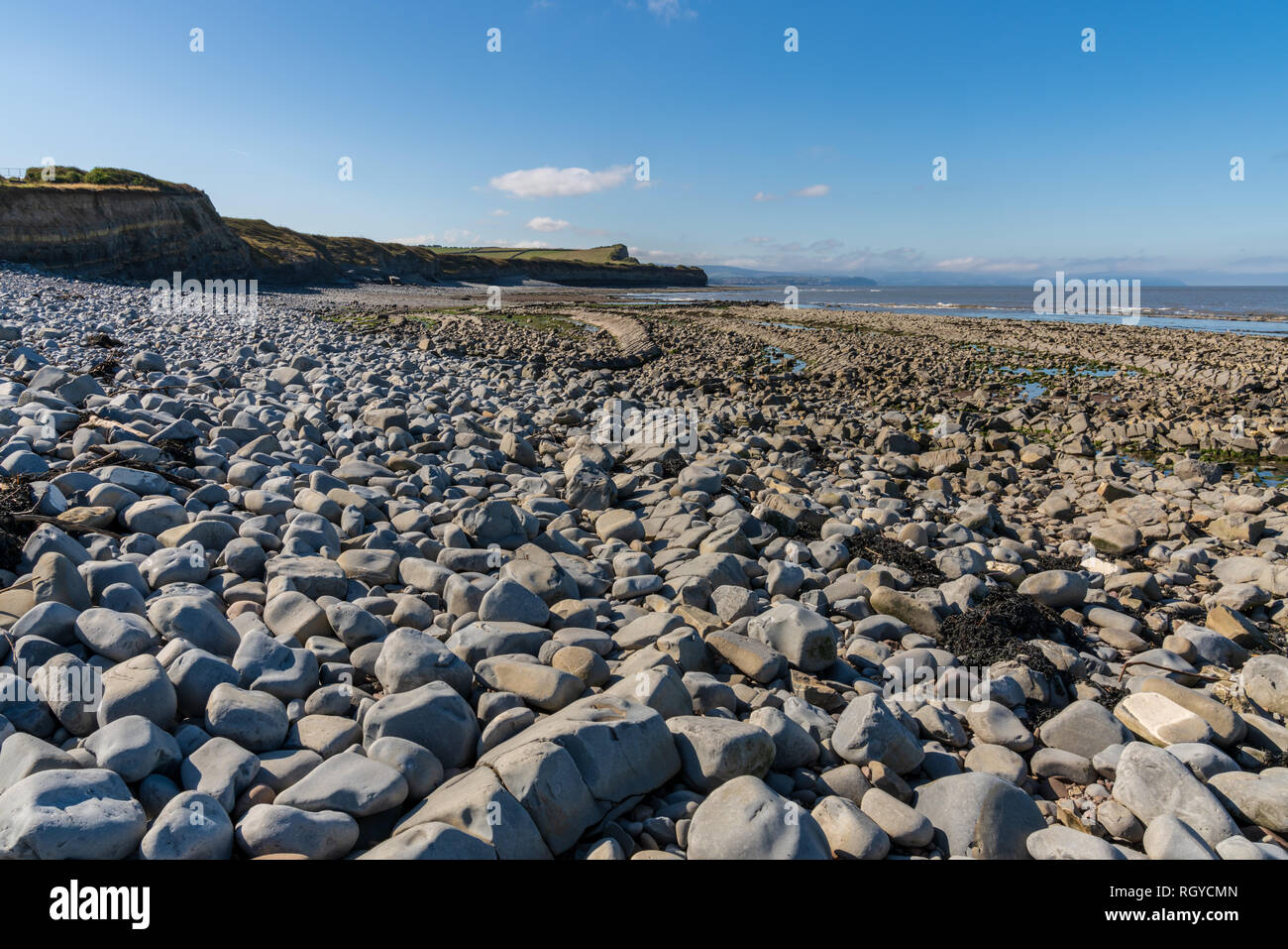 The stones of Kilve Beach in Somerset, England, UK - looking over the ...