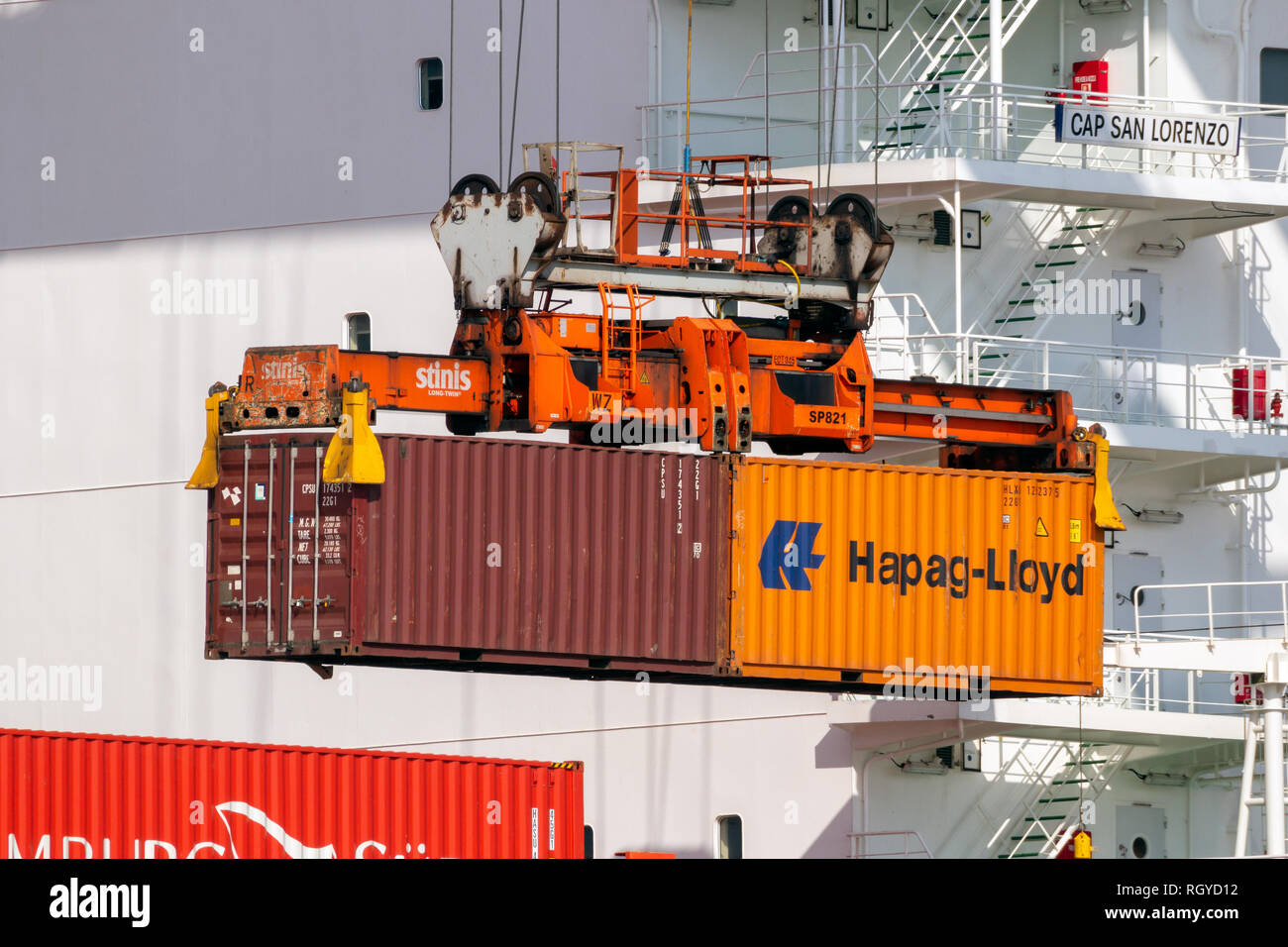 ROTTERDAM - MAR 16, 2016: Crane operator unloading a sea container from ...
