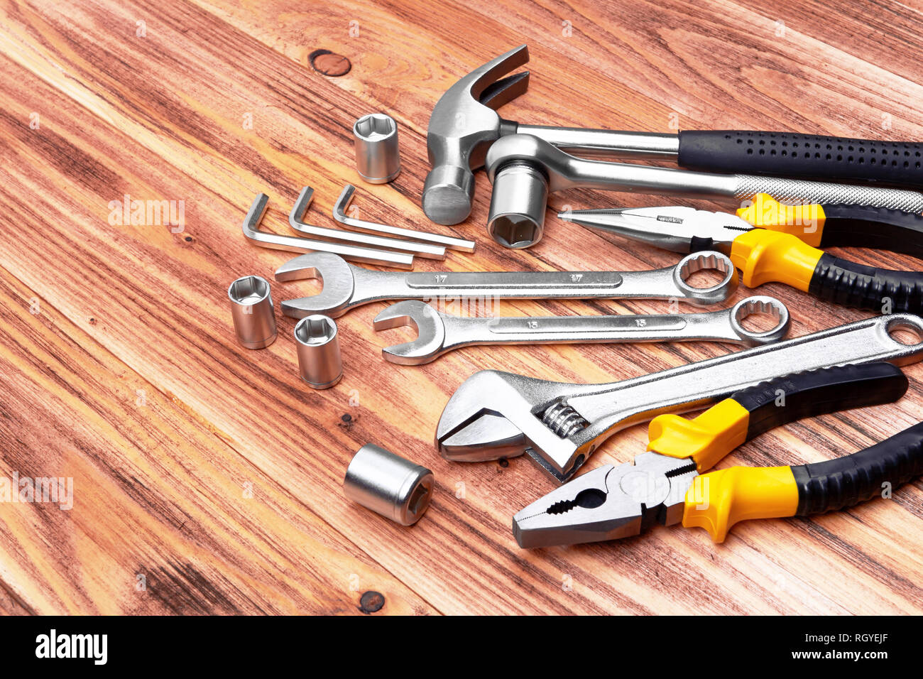 Different kinds of tools on wooden background Stock Photo - Alamy