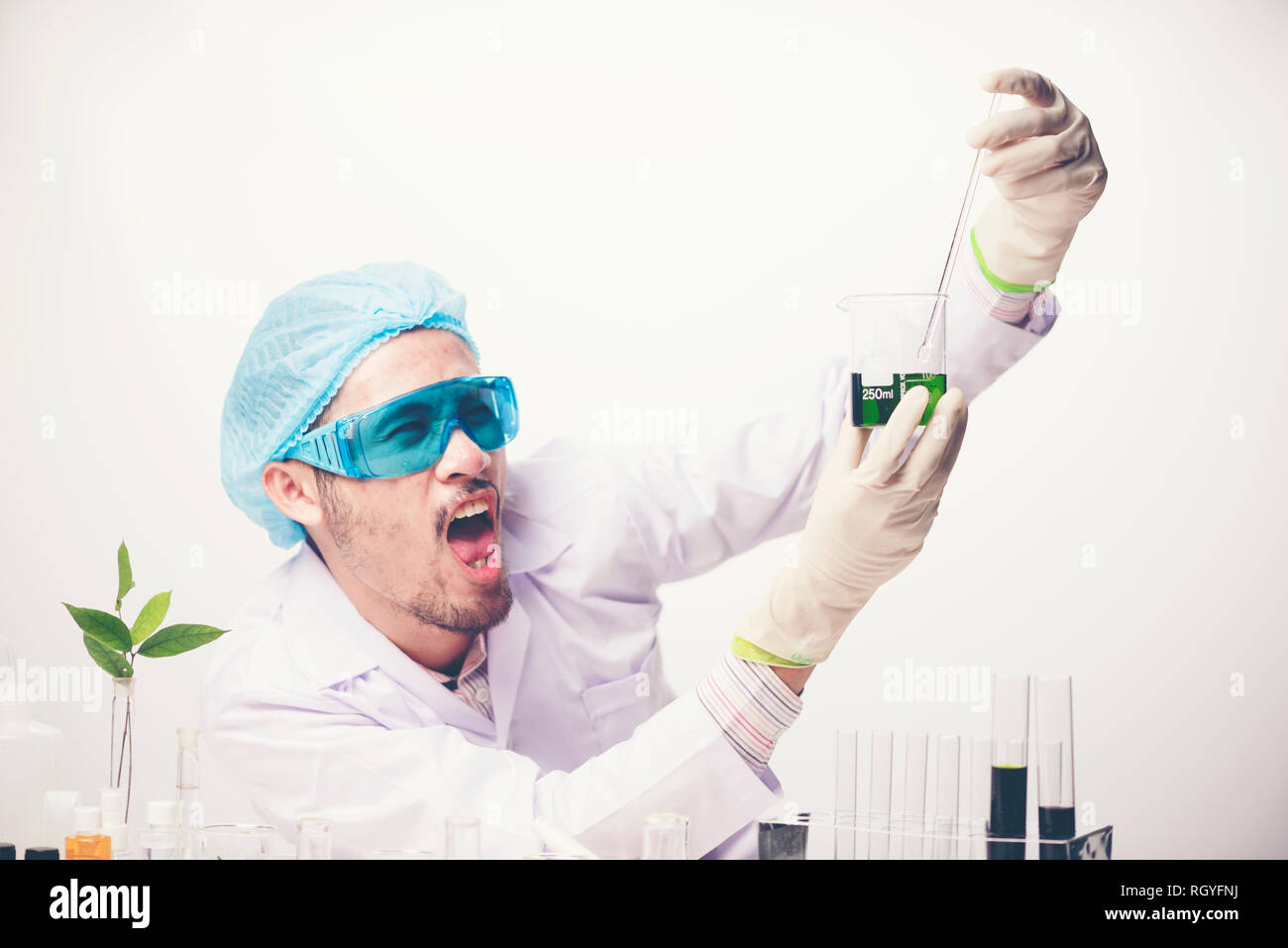 Conical flask in scientist hand with lab glassware background ... Conical flask in scientist hand with lab glassware background ...