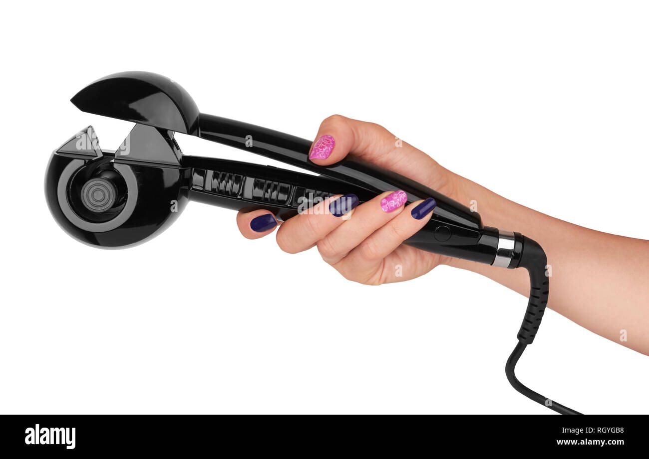 Black electric curling iron in hand isolated on white background Stock ...