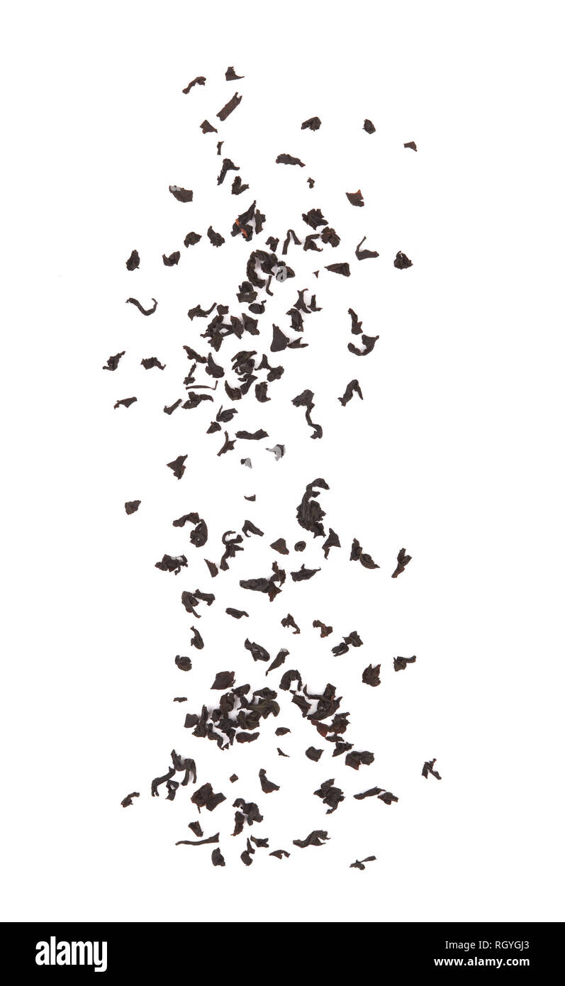 Falling dried tea leaves isolated on white background Stock Photo - Alamy