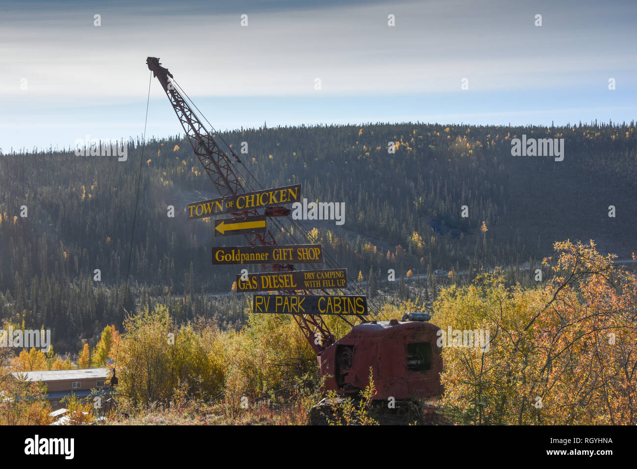 Chicken, Alaska, USA, welcome sign hanging on old dragline or crane ...