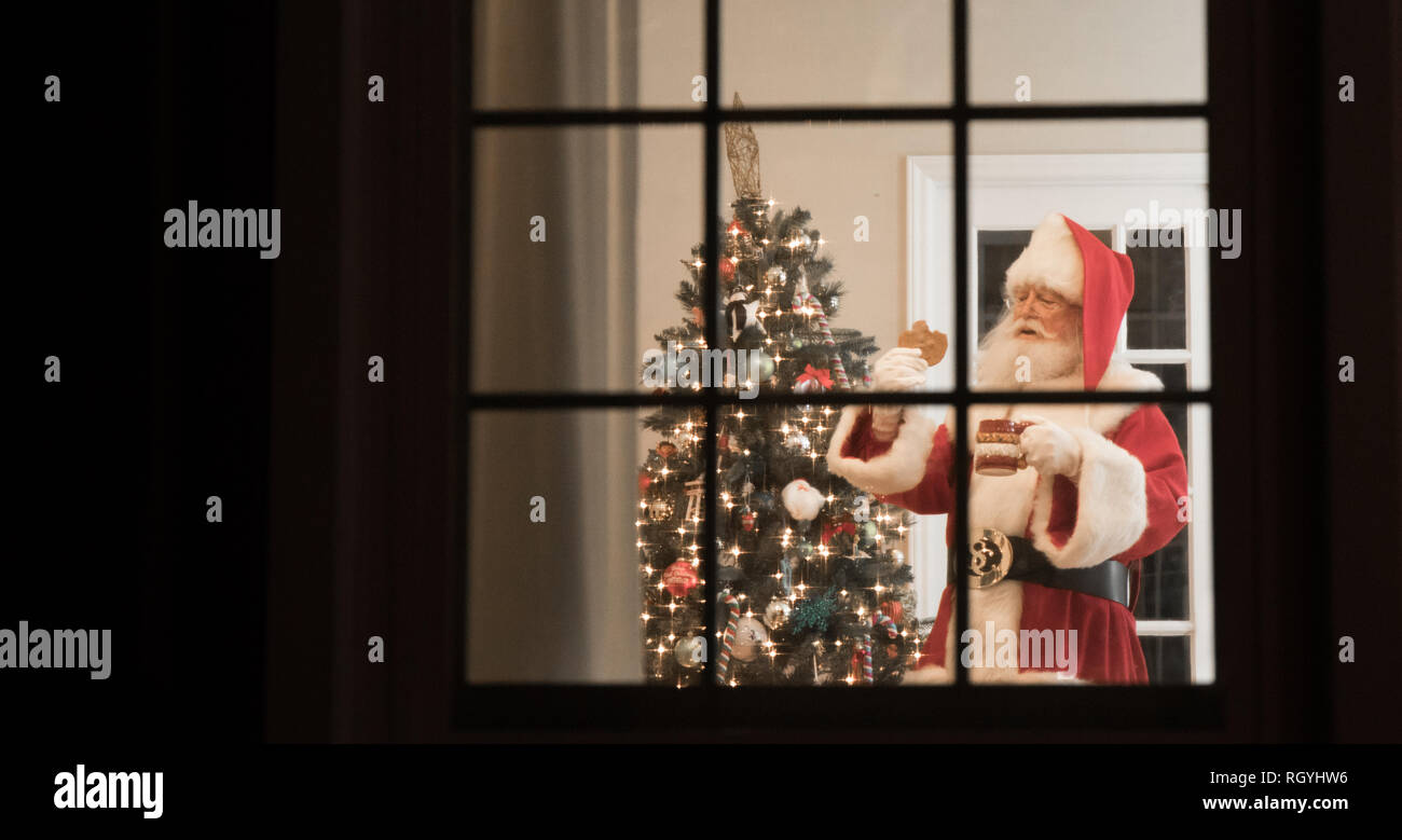 Christmas tree seen through window hi-res stock photography and images ...