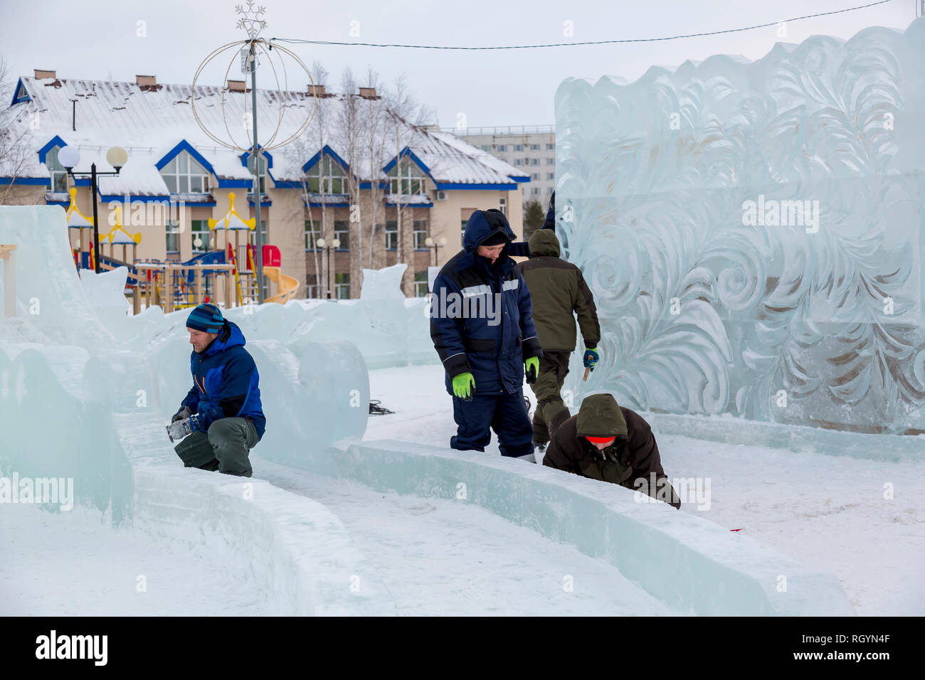 Electricians mount a power cable to illuminate ice figures Stock Photo ...