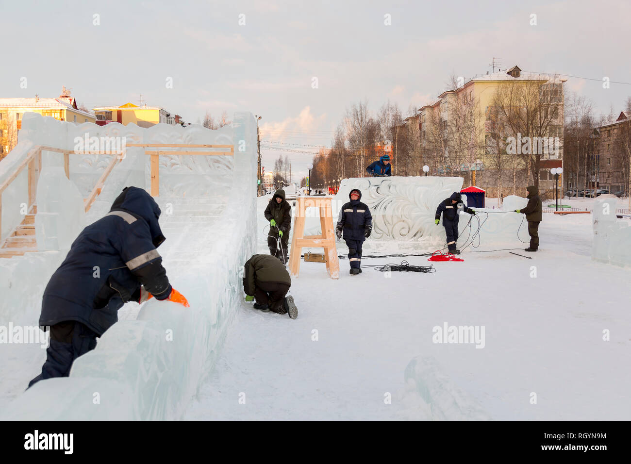 Electricians mount a power cable to illuminate ice figures Stock Photo ...