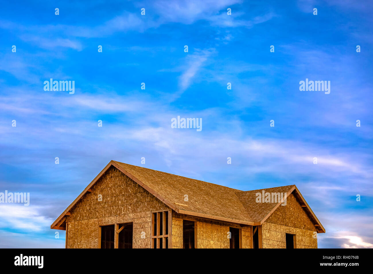 An unfinished home with peaceful sky background Stock Photo - Alamy