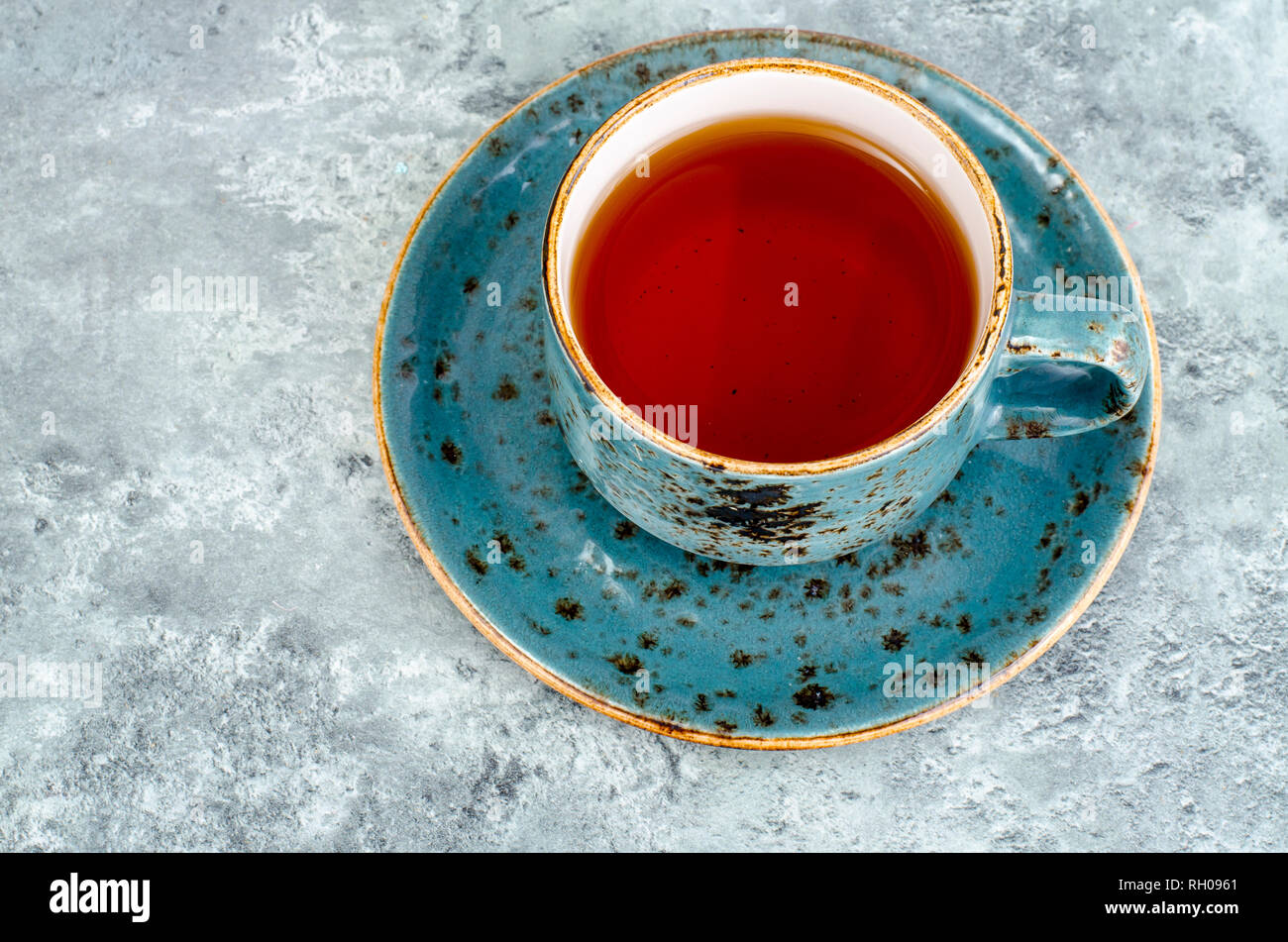 Hot tea in blue cup and saucer. Studio Photo Stock Photo - Alamy