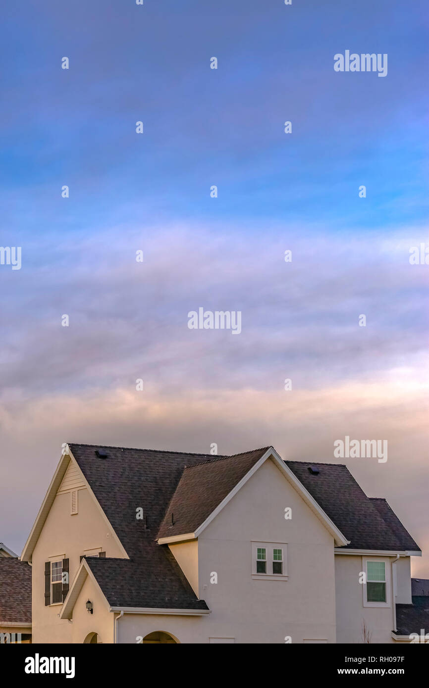 Beautiful home with striking cloudy sky background Stock Photo - Alamy