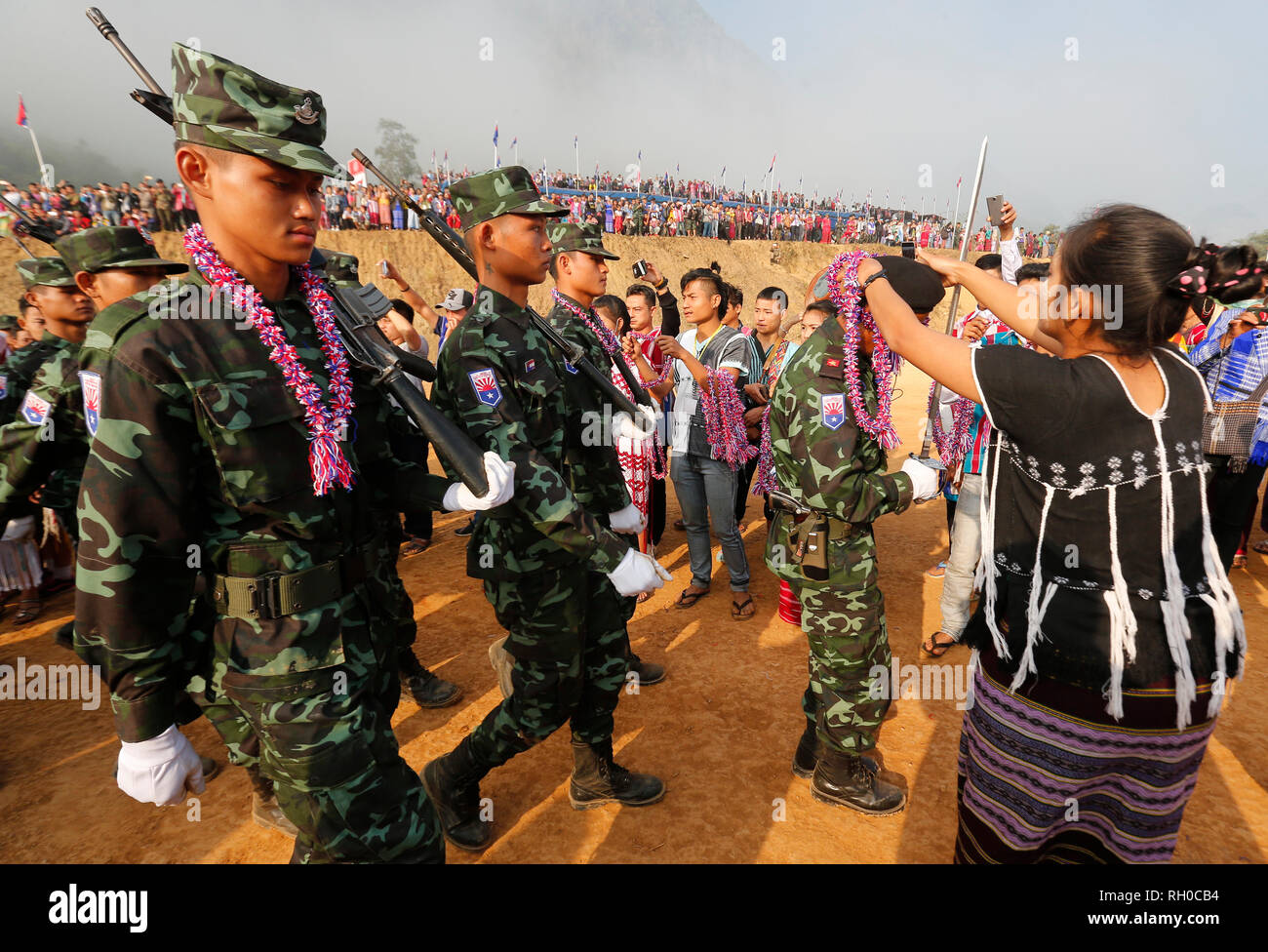 Karen National Union (KNU) soldiers receives a garland from people ...