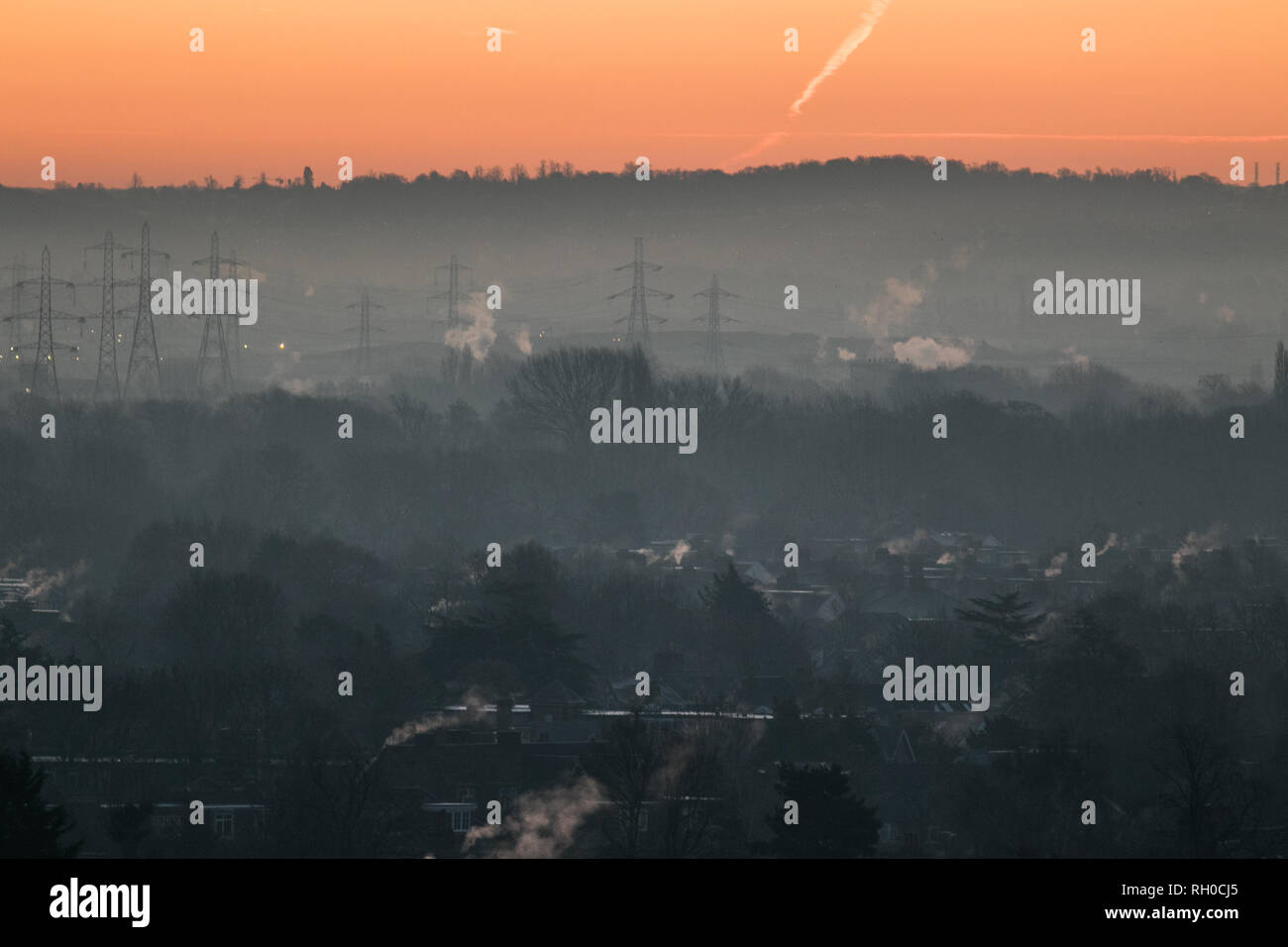 London, UK. 31st Jan, 2019. A colourful sunrise in Wimbledon on a ...