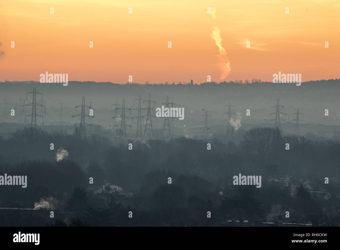 London, UK. 31st Jan, 2019. A colourful sunrise in Wimbledon on a ...