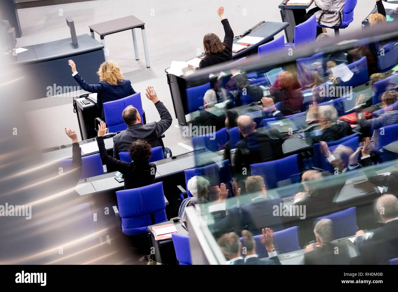 Berlin, Germany. 31st Jan, 2019. Members of the German Bundestag raise ...
