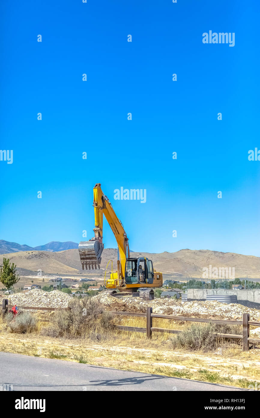 Excavator in Eagle Mountain Utah construction site Stock Photo - Alamy