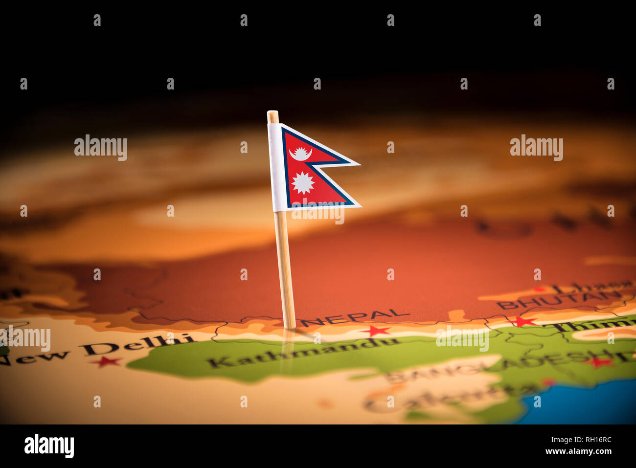 Nepal marked with a flag on the map Stock Photo - Alamy