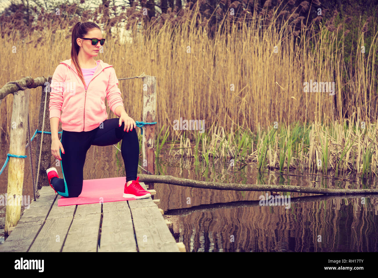 Sports and activities concept. Slim fit attractive woman exercising ...