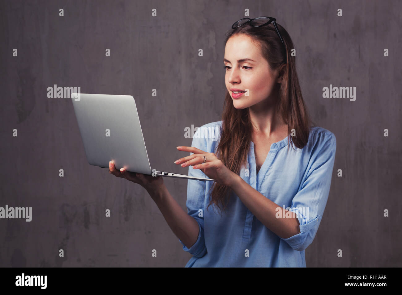 Beautiful woman using laptop lying hi-res stock photography and images ...