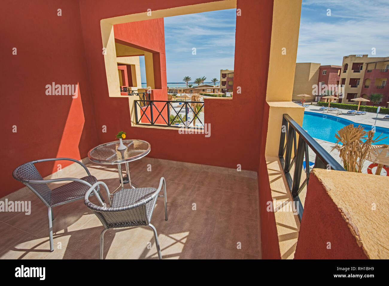 View from a balcony terrace of luxury hotel resort room with swimming ...