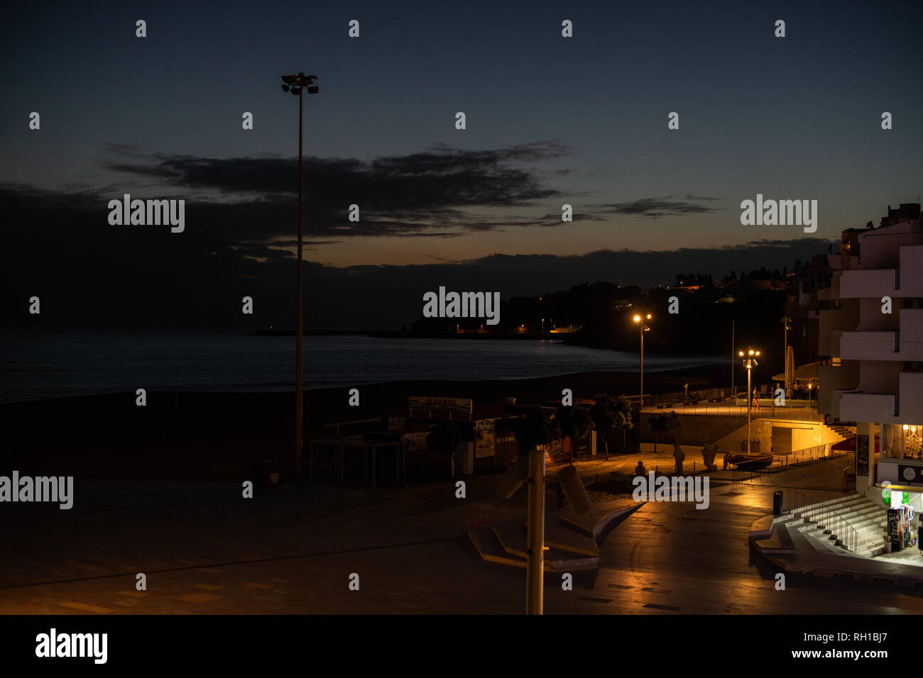 Albufeira City Center at Night with view of Ocean and beach. Portugal ...