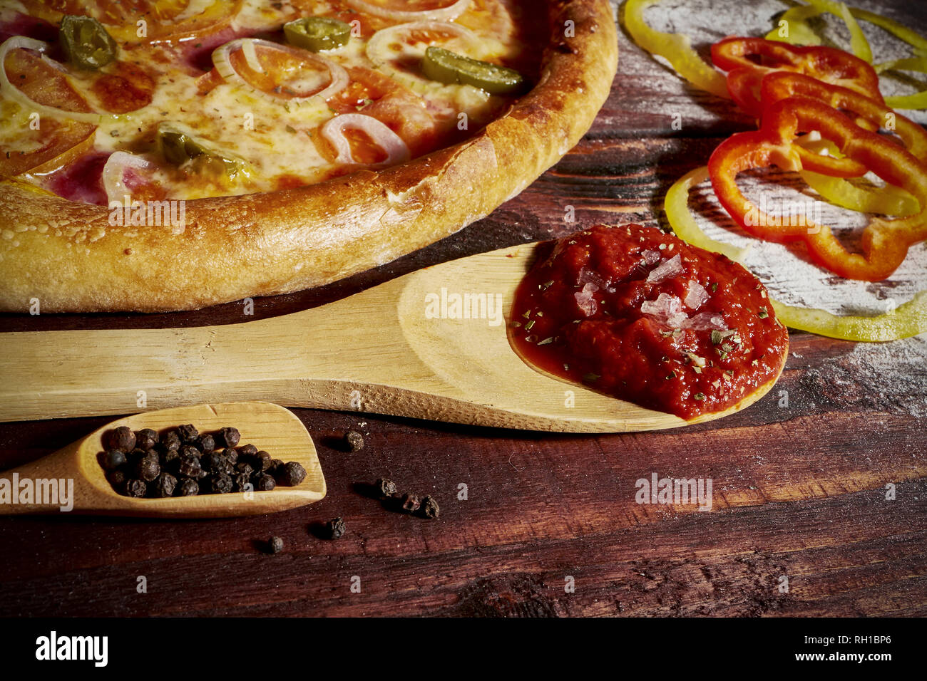Delicious seafood shrimps and mussels pizza on a black wooden table ...