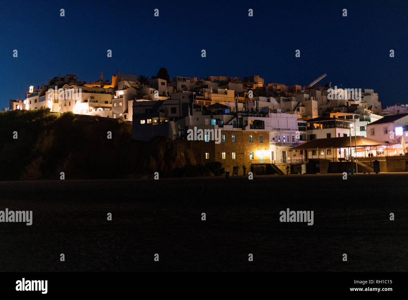 Albufeira City Center at Night with view of Ocean and beach. Portugal ...