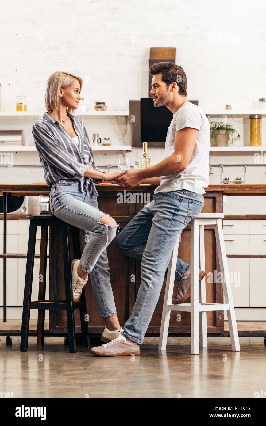 attractive girlfriend and handsome boyfriend holding hands Stock Photo ...