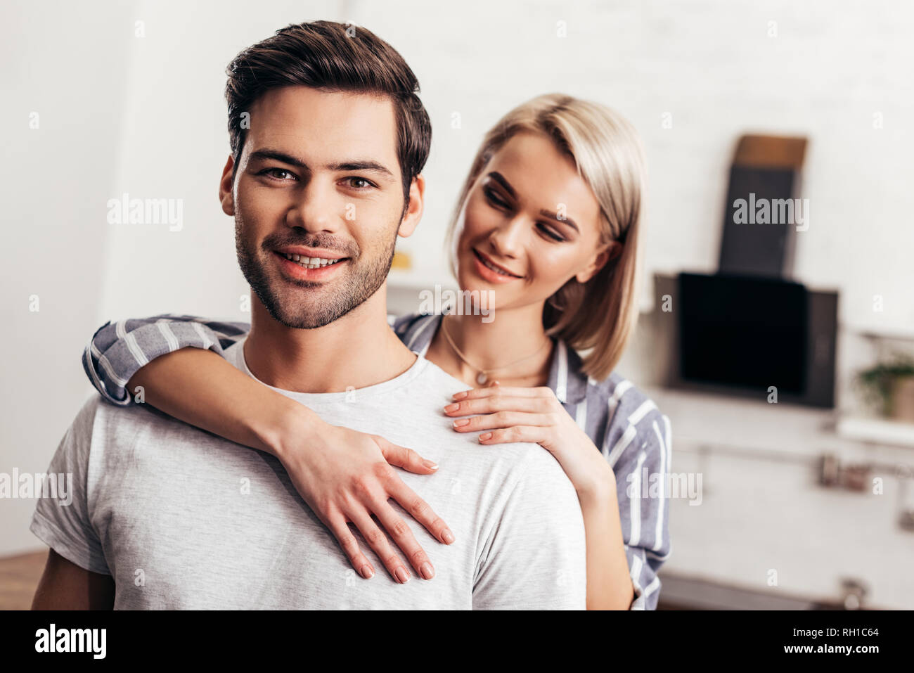 Romantic boyfriend hugging girlfriend hi-res stock photography and ...