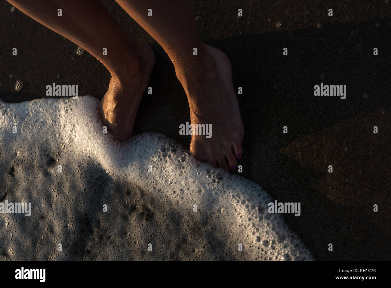 Feet beach waves hi-res stock photography and images - Alamy