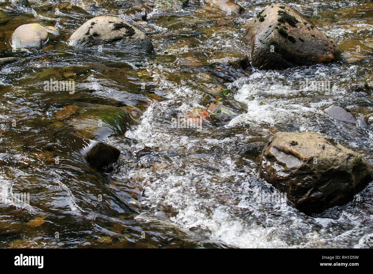 Water flowing over pebbles hi-res stock photography and images - Alamy
