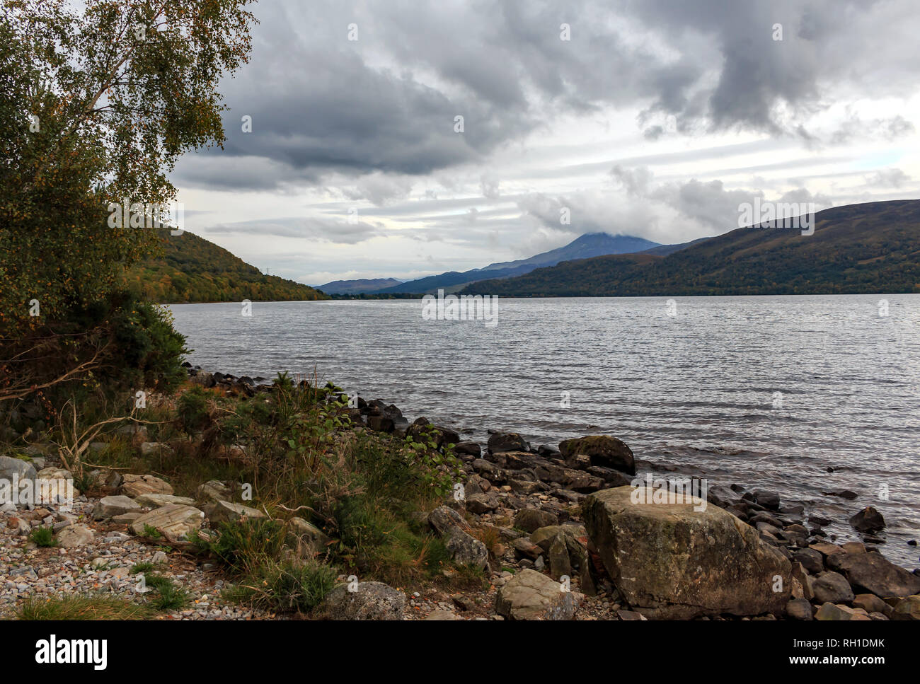 shoreline view with rocks of Loch Rannoch Scotland and the a distant ...