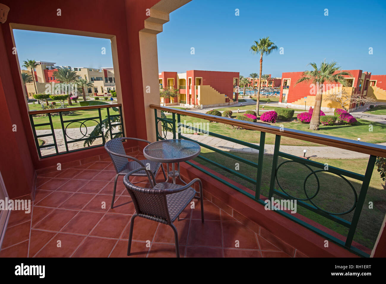 View from a balcony terrace of luxury hotel resort room with gardens ...
