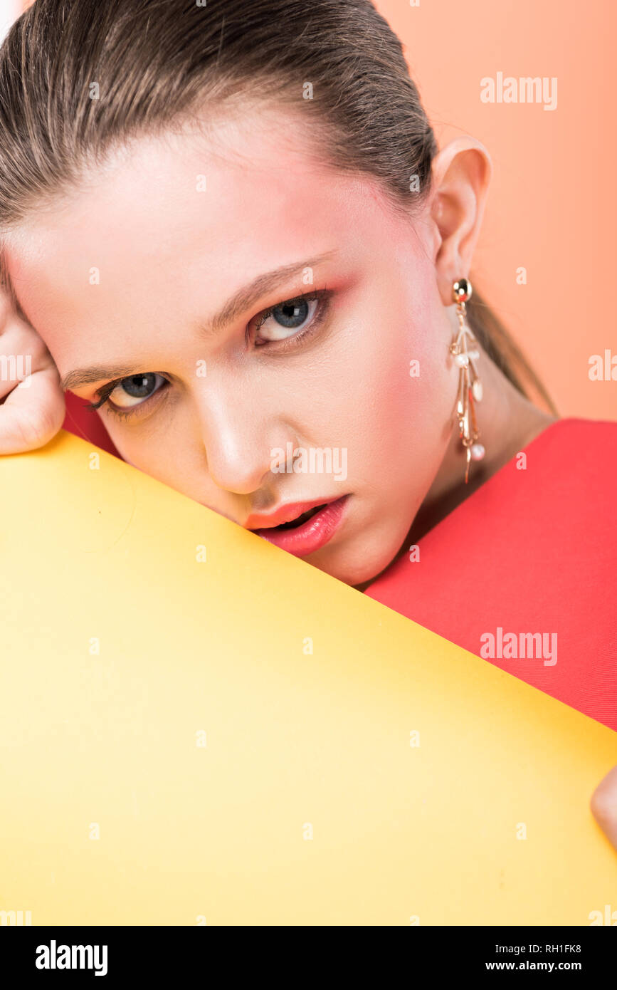 beautiful stylish girl with limelight paper looking at camera and ...