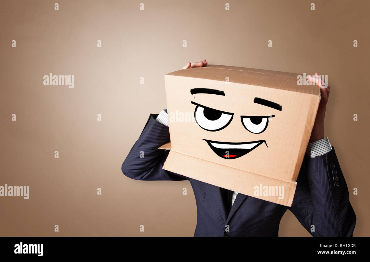 Young man with happy face illustrated cardboard box on his head Stock ...