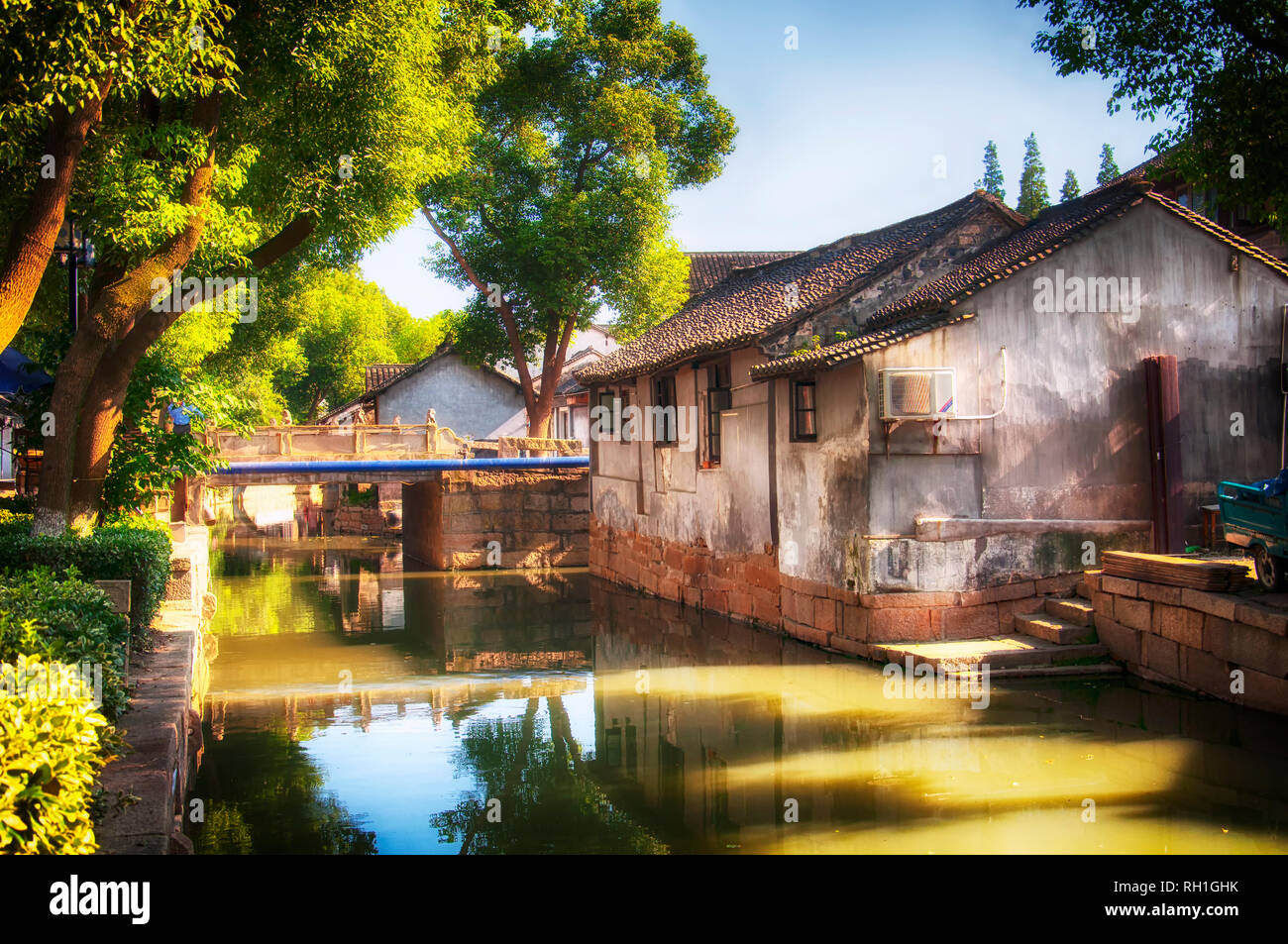 Weathered Chinese buildings line the water canals of Luzhi water town ...