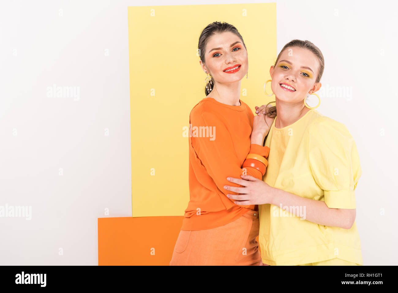 beautiful stylish girls posing and smiling with turmeric and limelight ...