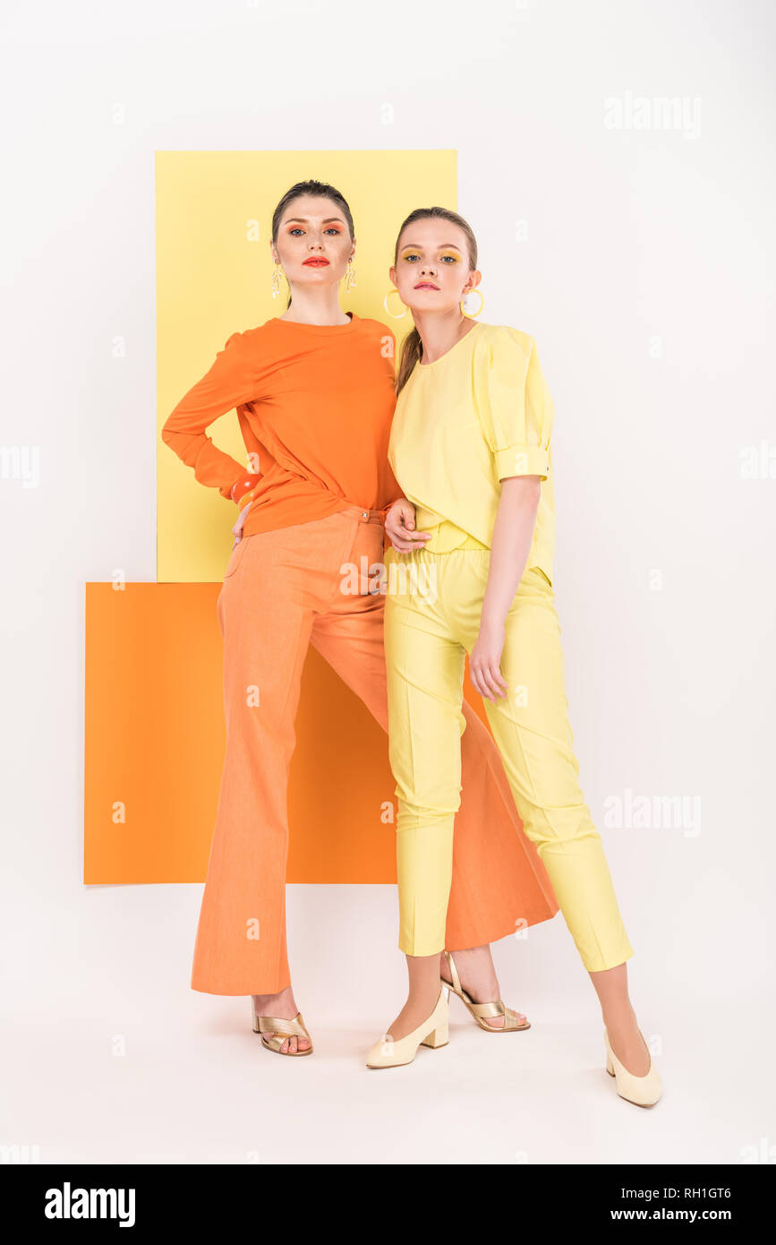 confident stylish girls posing with turmeric and limelight on ...